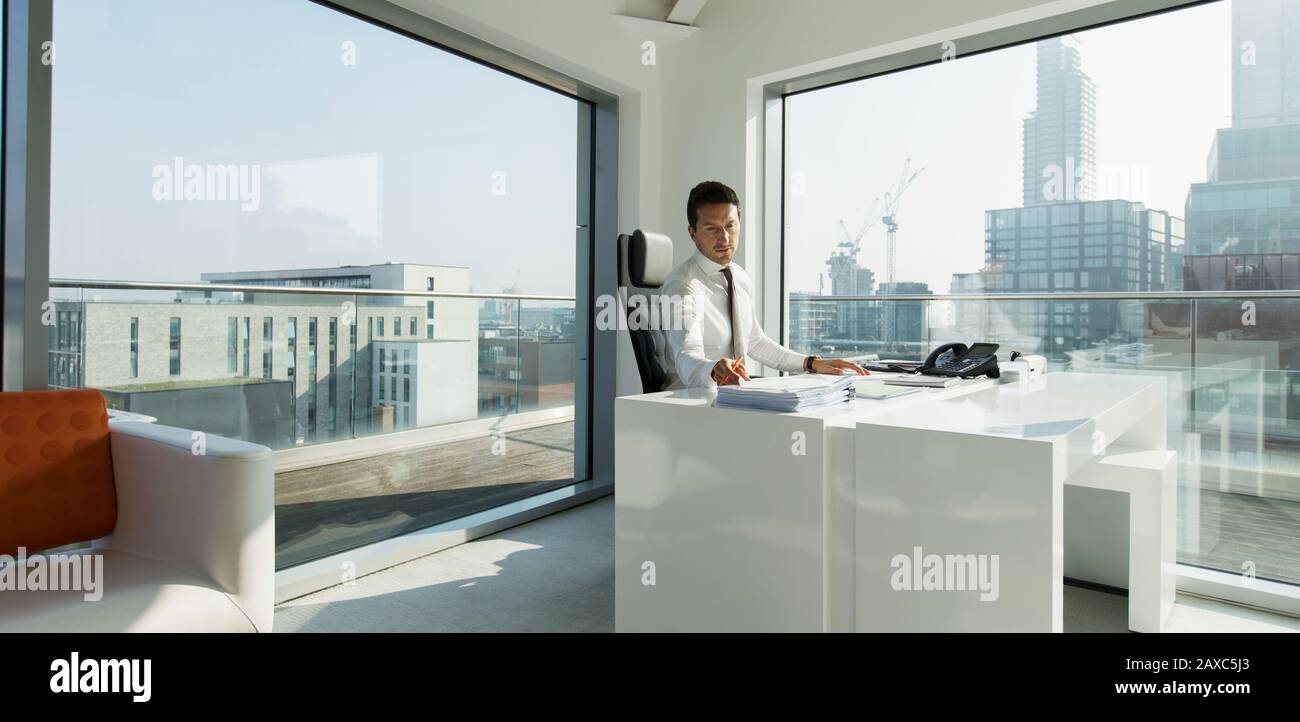 Side view caucasian businessman working hi-res stock photography and ...