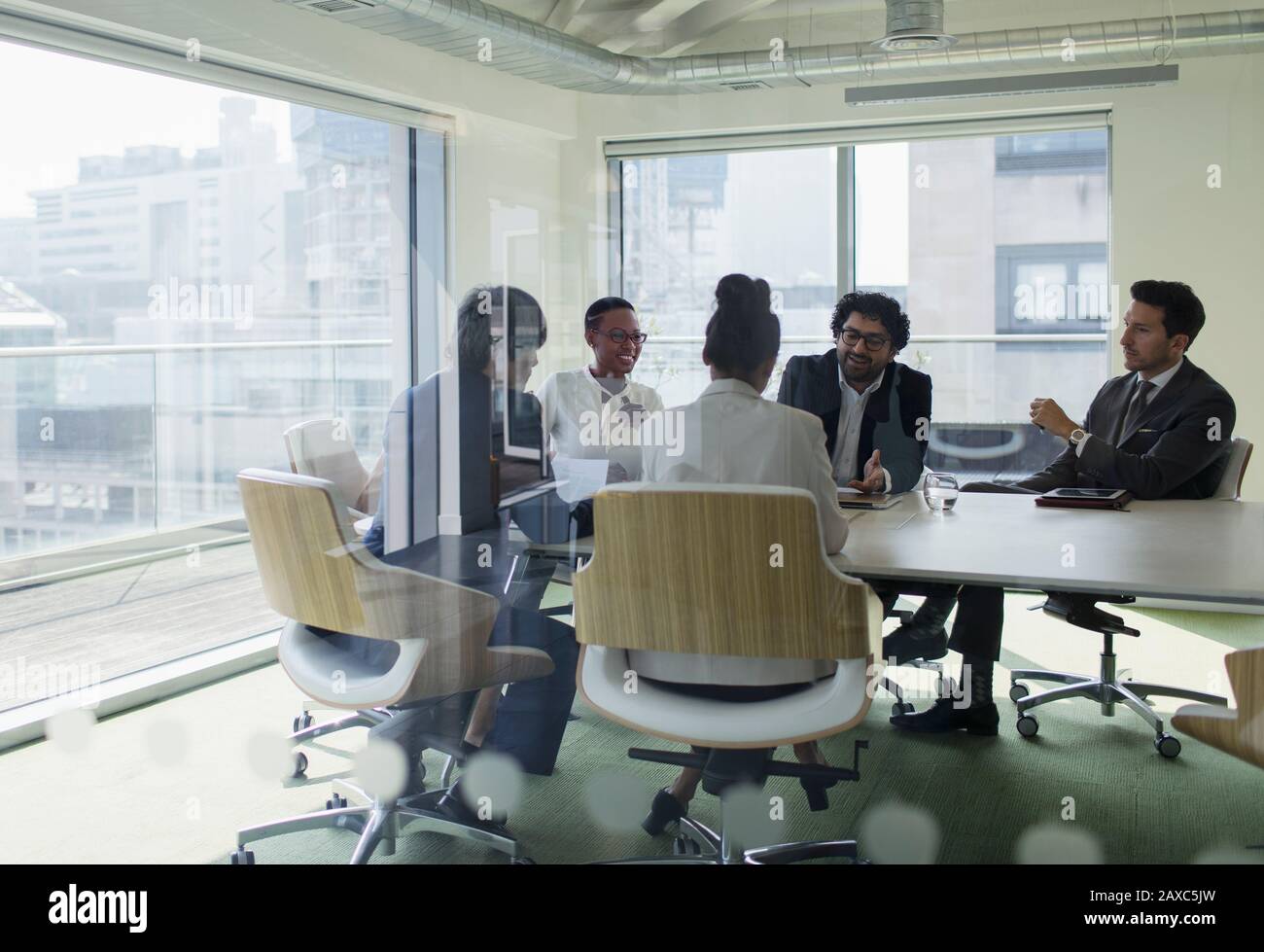 Business people talking in conference room meeting Stock Photo - Alamy