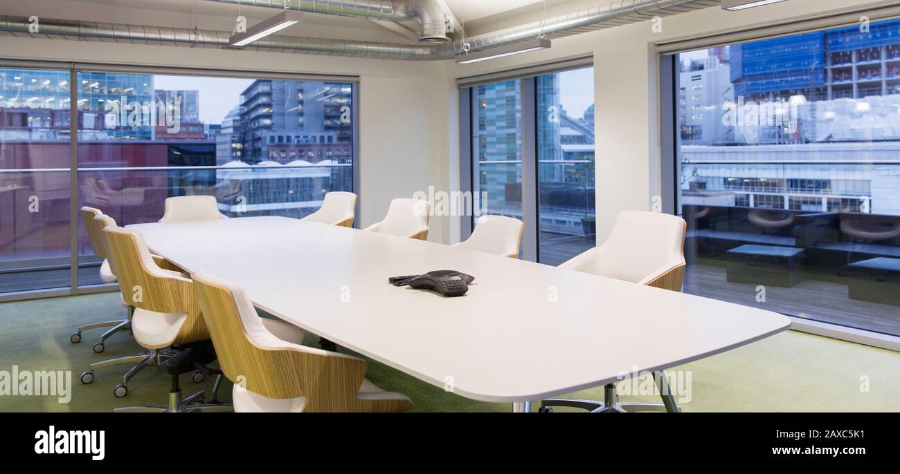 Conference table in modern, urban conference room Stock Photo - Alamy