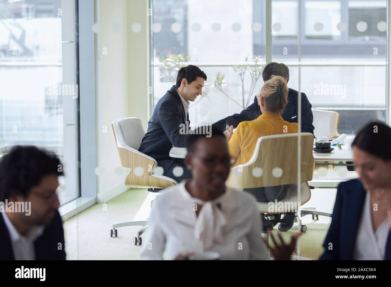 Business people talking in conference room meeting Stock Photo - Alamy