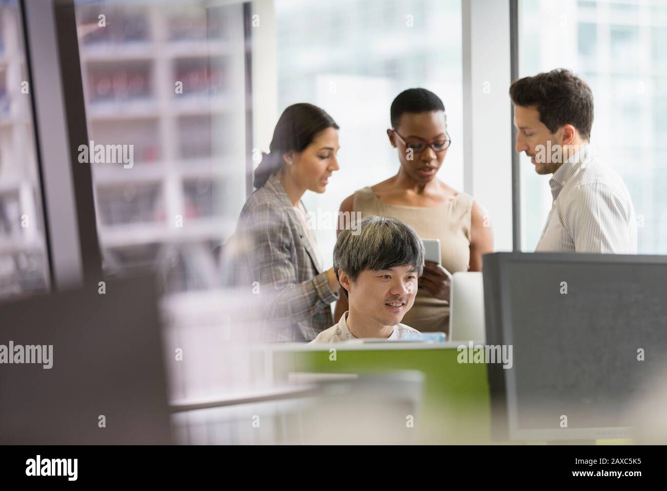 Business people look at computer hi-res stock photography and images ...