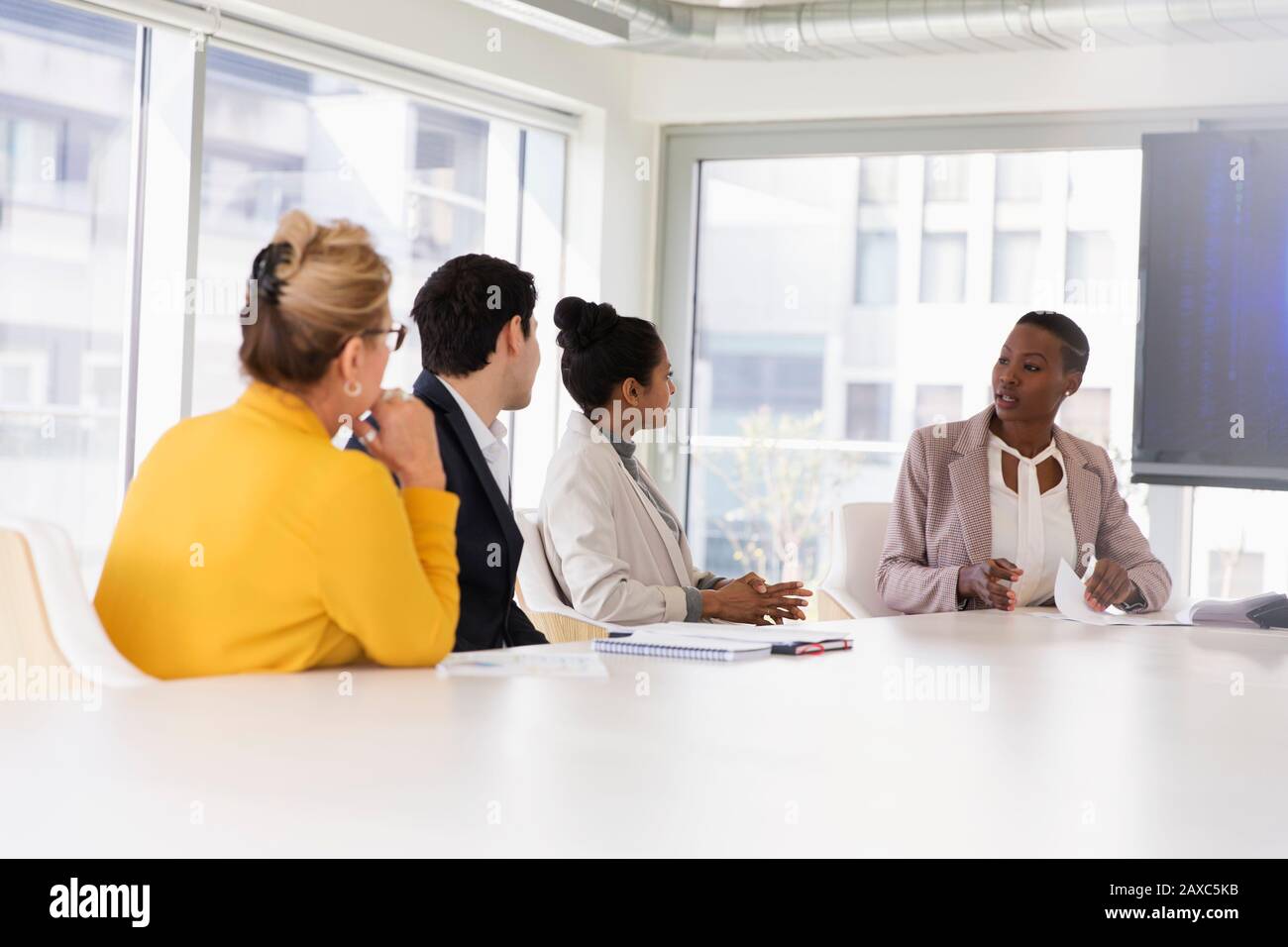 Business people talking in conference room meeting Stock Photo - Alamy
