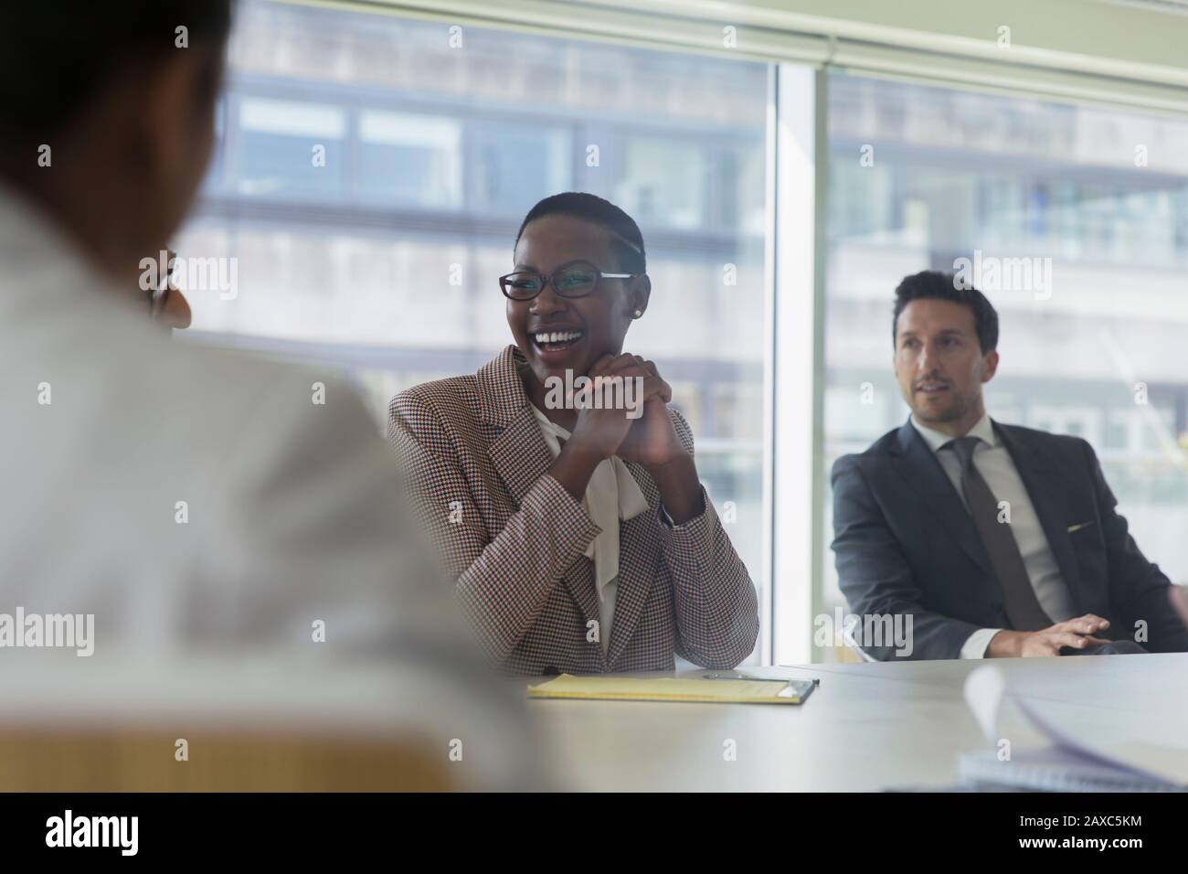 Business people laughing in a meeting hi-res stock photography and ...