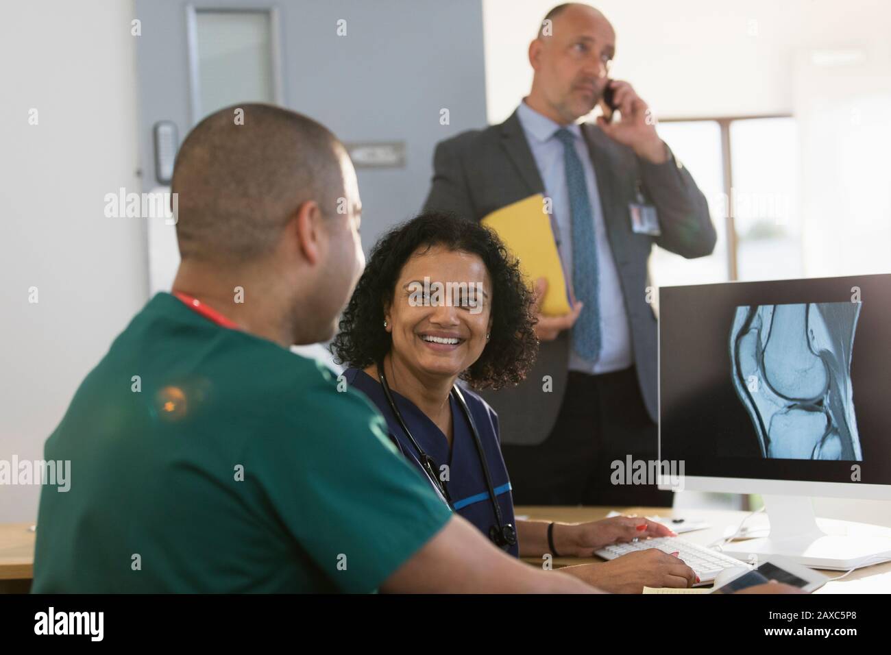 Nurses smiling together in hospital hi-res stock photography and images ...