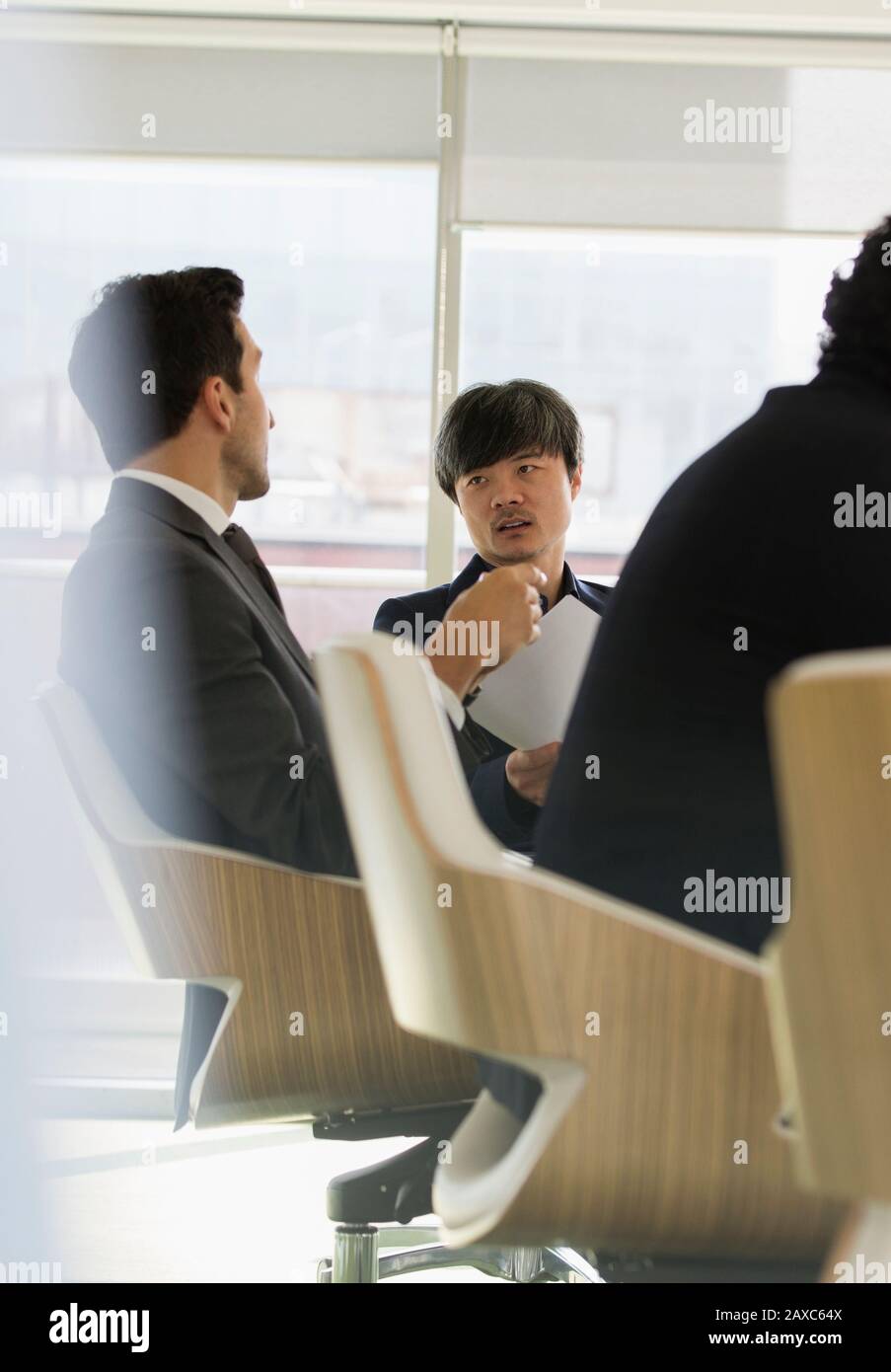 Businessmen talking in conference room meeting Stock Photo - Alamy