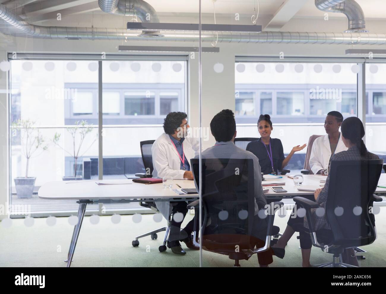 Doctors and administrators talking in conference room meeting Stock ...