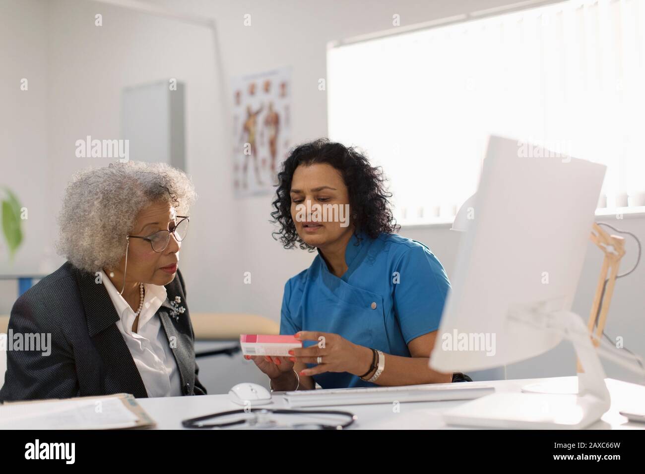 Female doctor prescribing medication senior hi-res stock photography ...