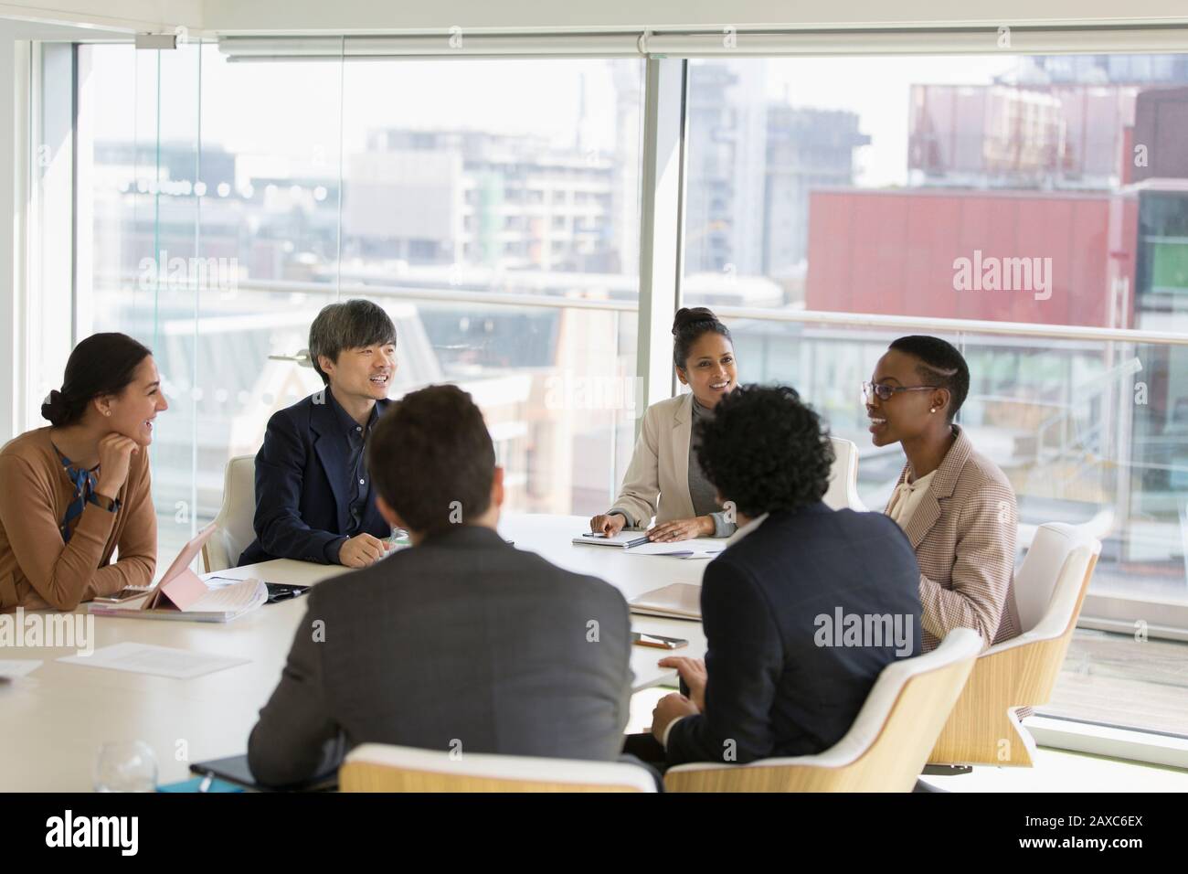 Business people talking in conference room meeting Stock Photo - Alamy