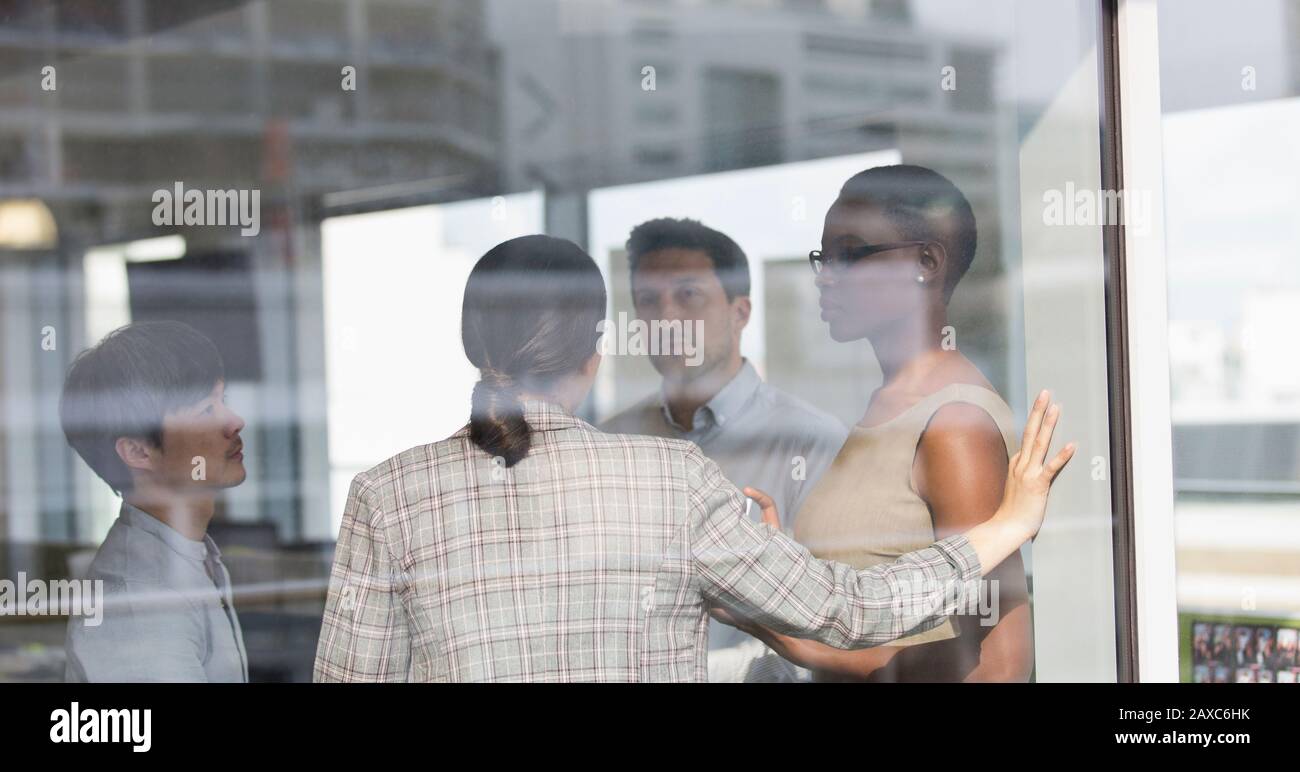 Business people talking at sunny urban office window Stock Photo - Alamy