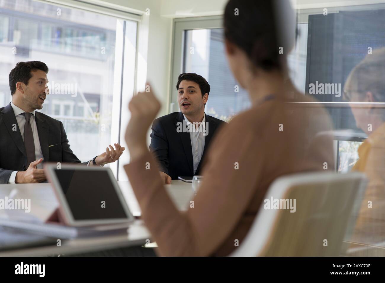 Businessmen talking in conference room meeting Stock Photo - Alamy