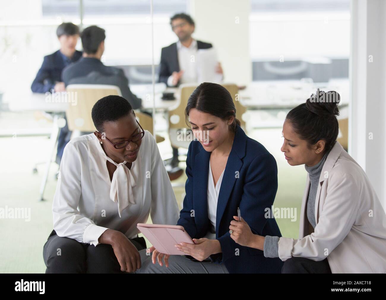 Business people using tablet together hi-res stock photography and ...
