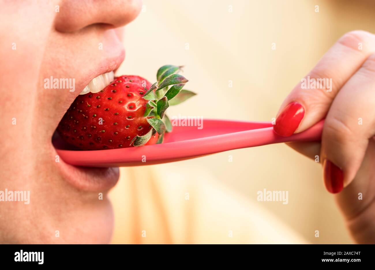 Woman mouth eating strawberry hi-res stock photography and images - Alamy