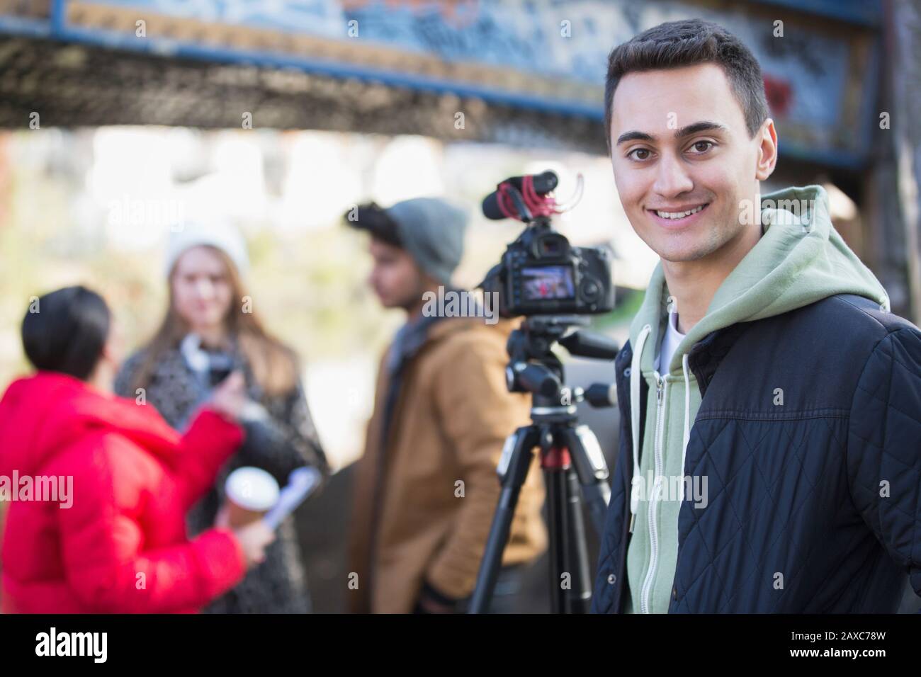 Portrait confident young man vlogging with friends Stock Photo - Alamy
