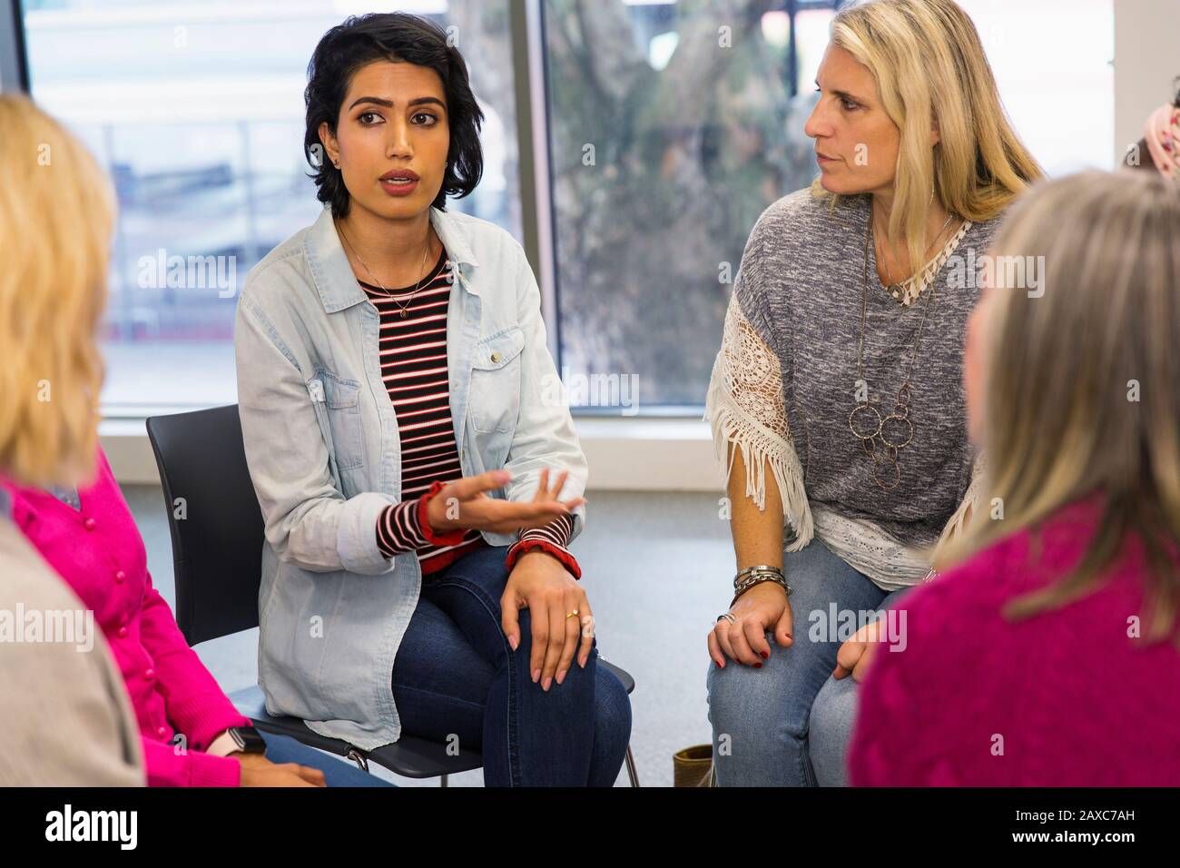 Women talking in support group circle Stock Photo - Alamy