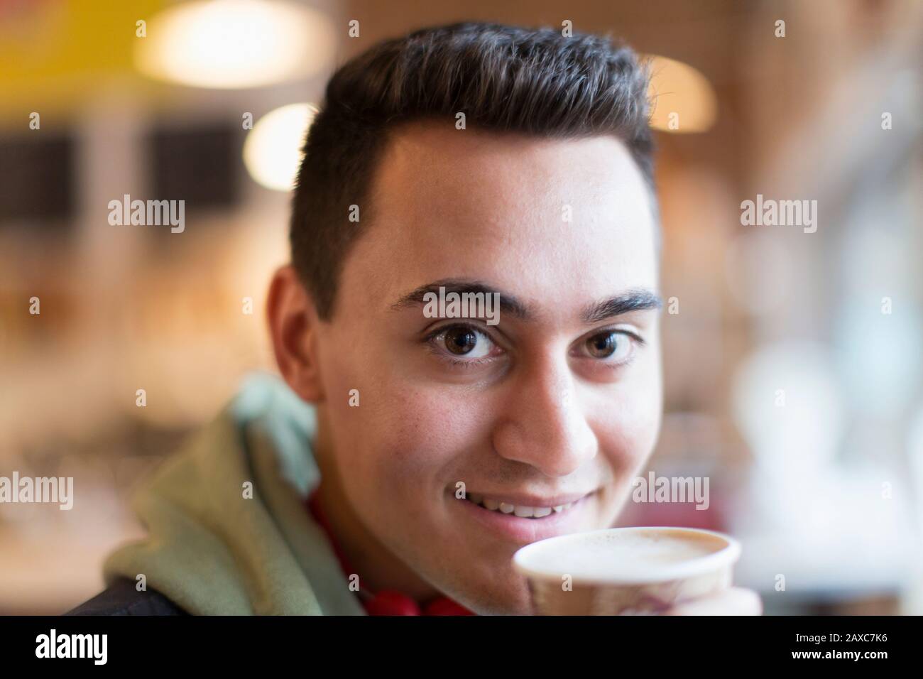 Close up portrait confident young man drinking coffee Stock Photo - Alamy Close up portrait confident young man drinking coffee Stock Photo - Alamy