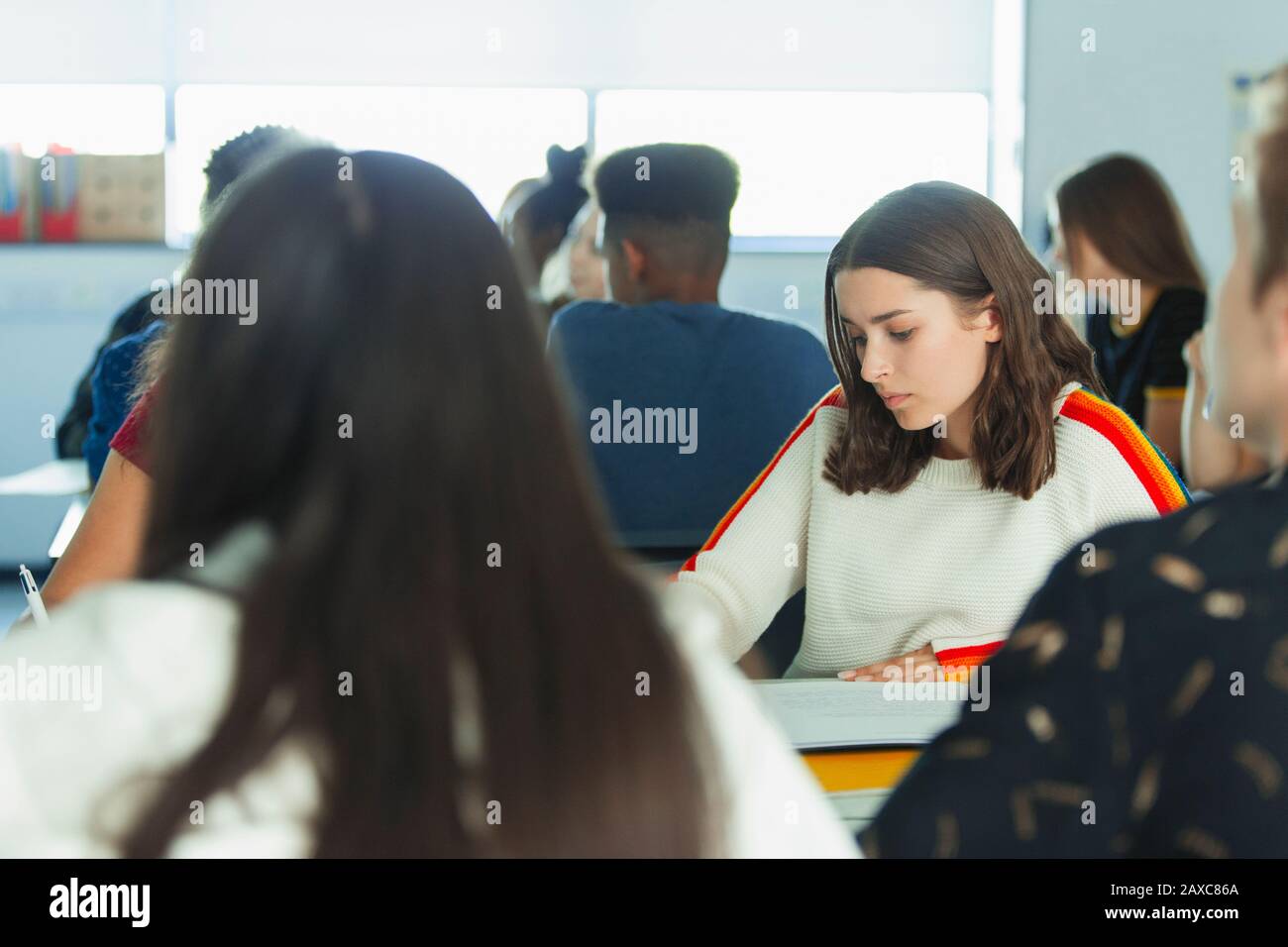Focused high school girl student studying in classroom Stock Photo - Alamy