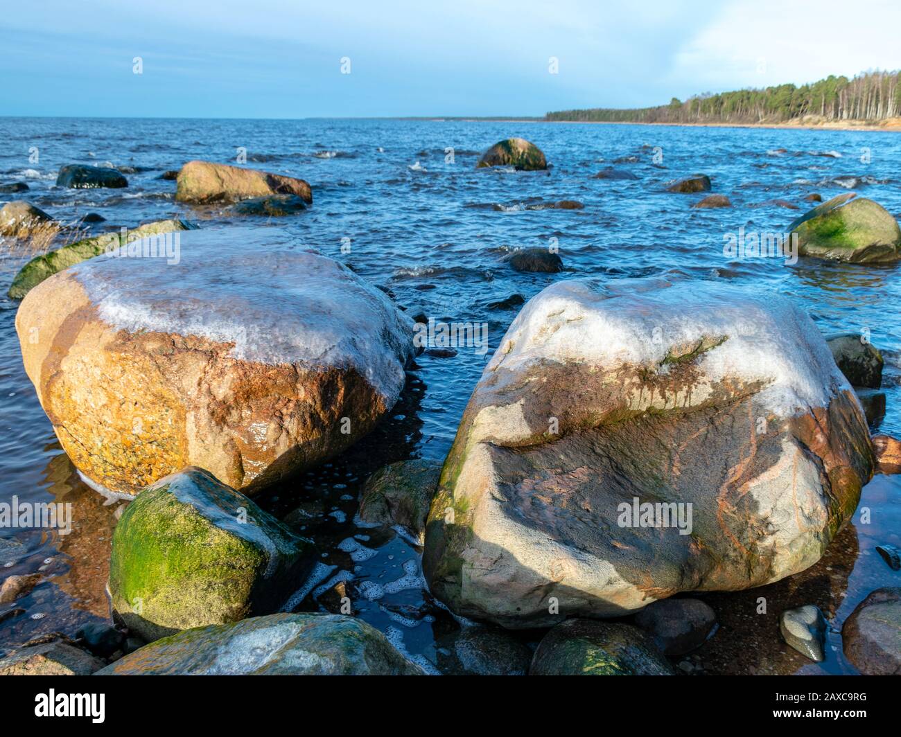landscape with stony beach, stones of various shapes in the sea Stock ...