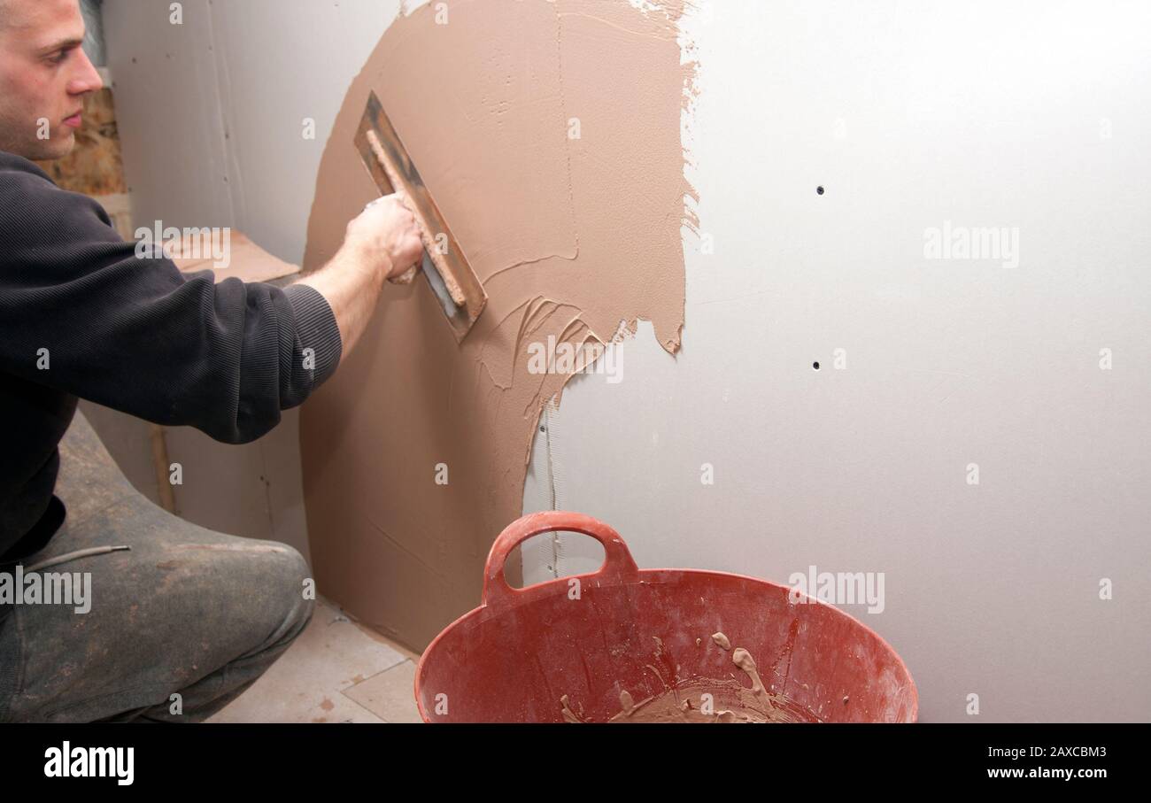 Plastering man hi-res stock photography and images - Alamy