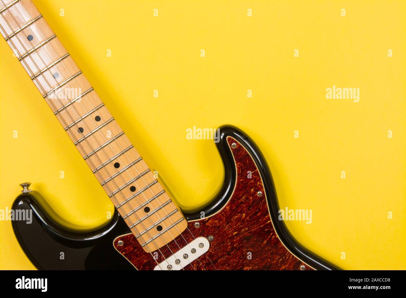 Close-up of electric guitar on yellow background, with copy space Stock ...