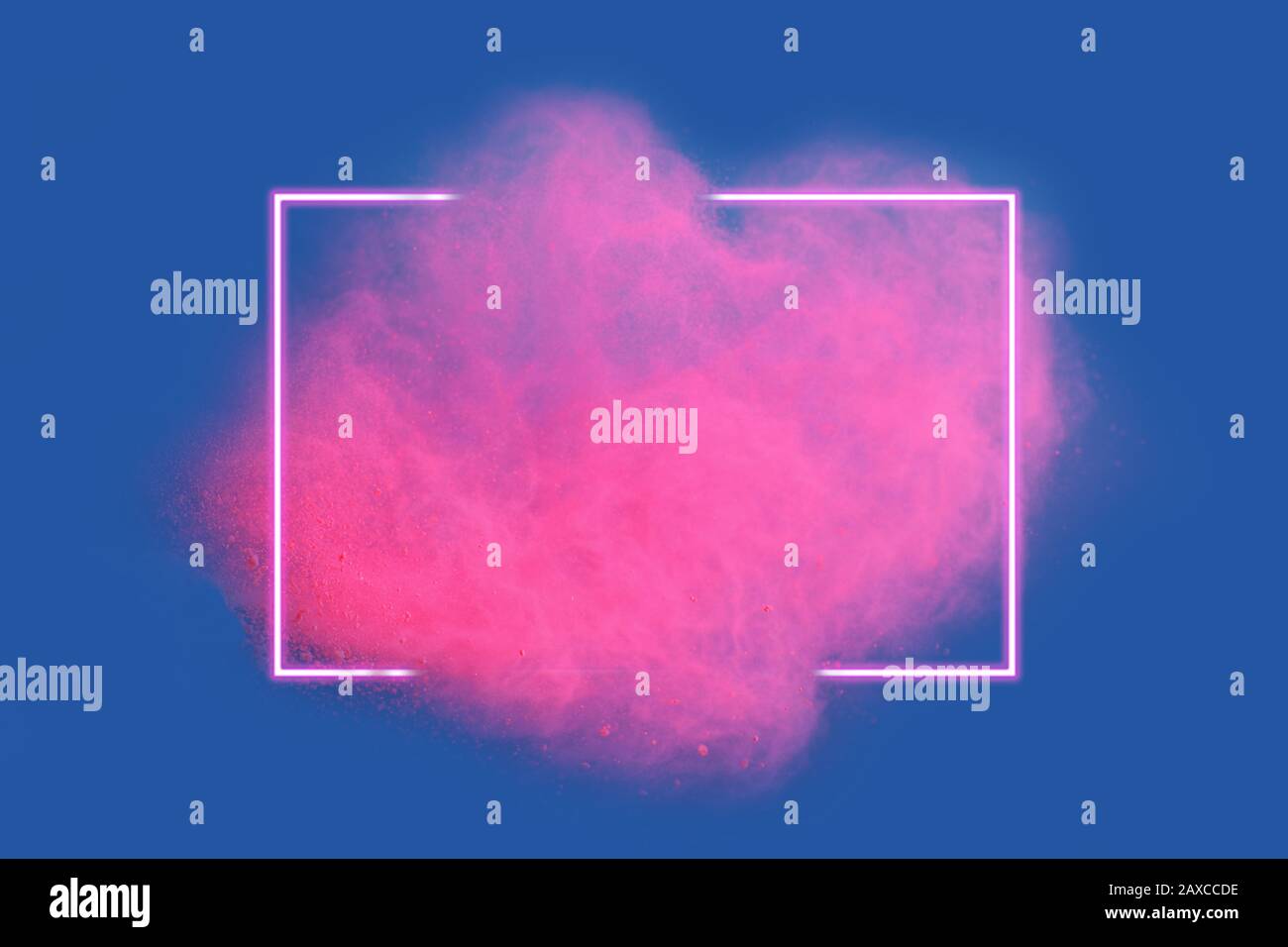 Pink neon powder explosion with gliwing frame on blue background ...
