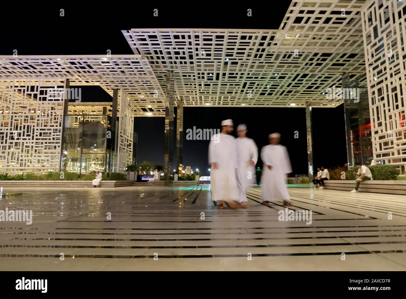 Muscat / Oman – February 11, 2020: Locals take an evening stroll through Al Marsa Plaza in the ...