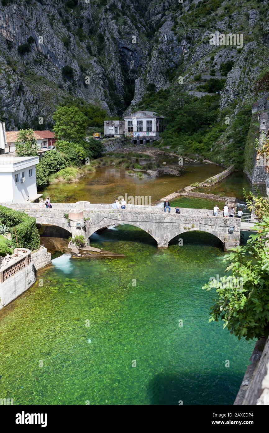 KOTOR, MONTENEGRO-CIRCA JUN, 2016: Stone bridge across moat passes to ...