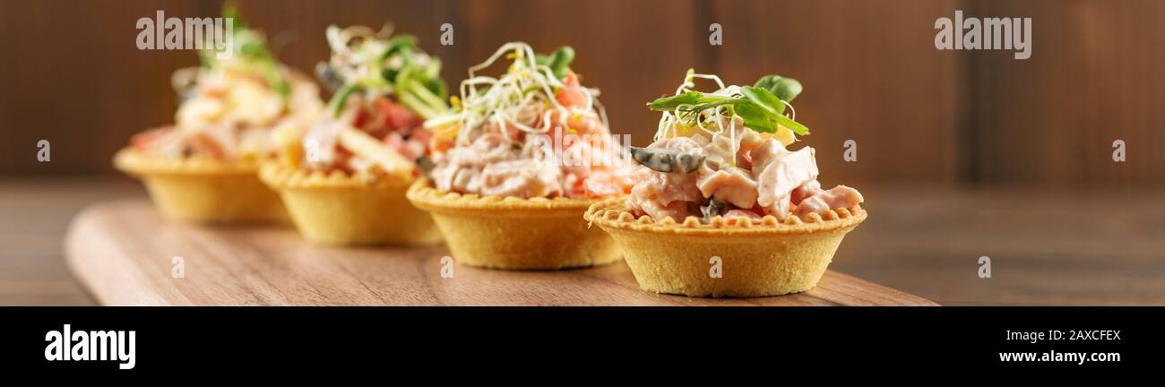 Tasty appetizers with meat and vegetables and microgreen. Banner for ...