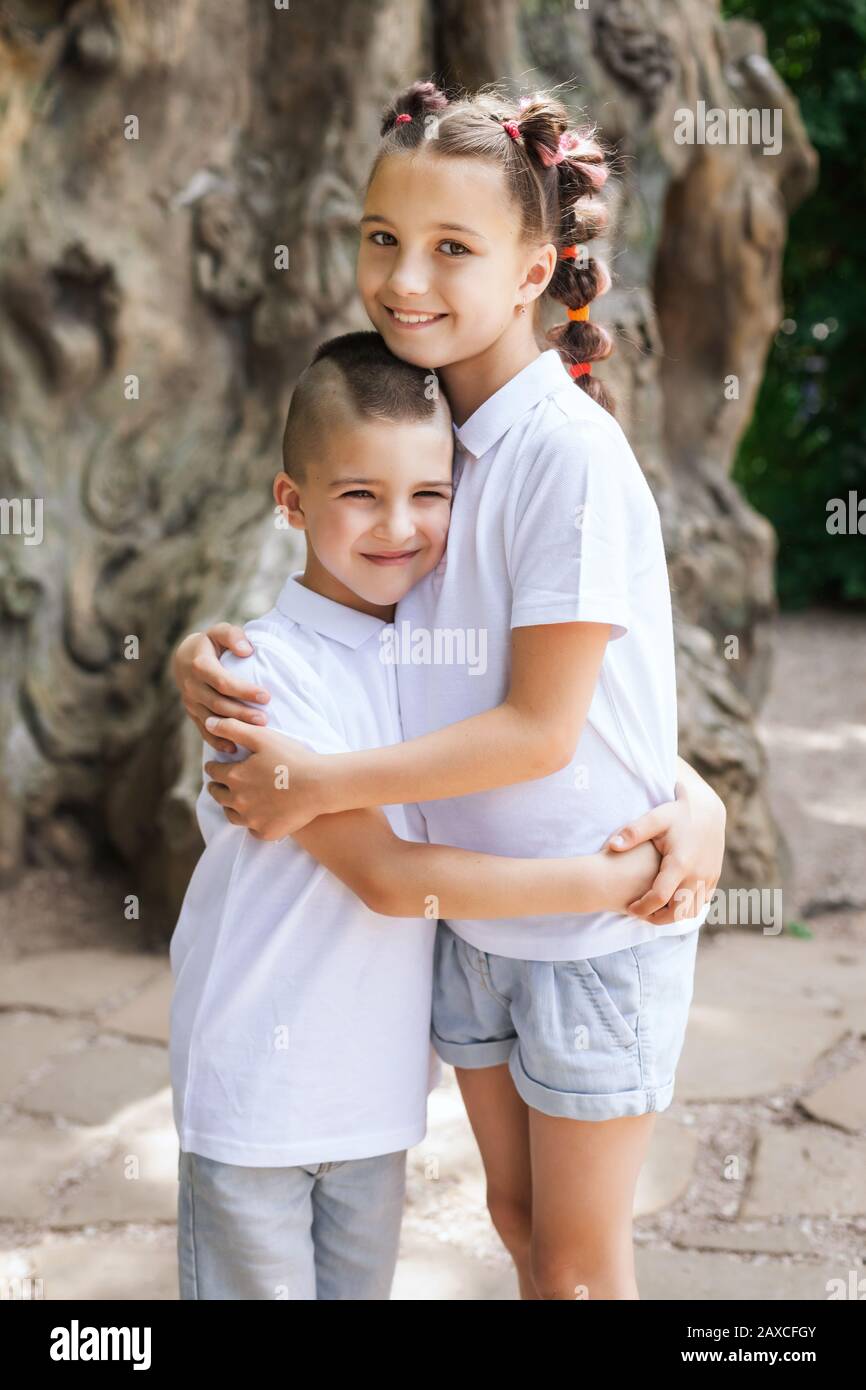 Brother And Sister Hugging