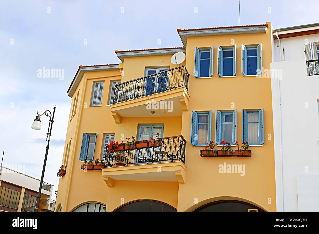 View of yellow house in Larnaca, Cyprus Stock Photo - Alamy