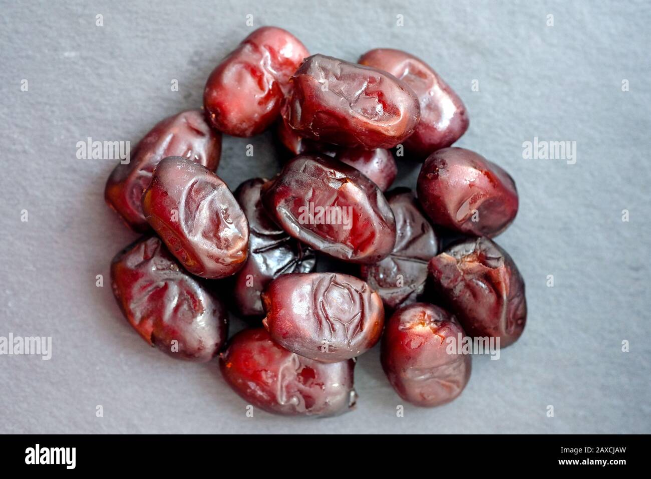 Dates on a black chalkboard. Dried dates top view. Date palm fruits ...