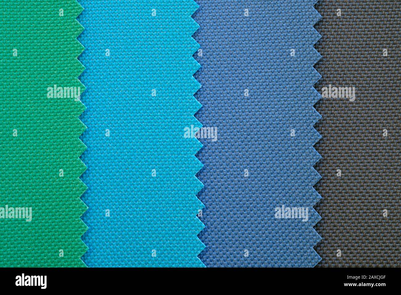 Samples of fabrics in pastel shades. Blue, green, grey piece of fabric ...