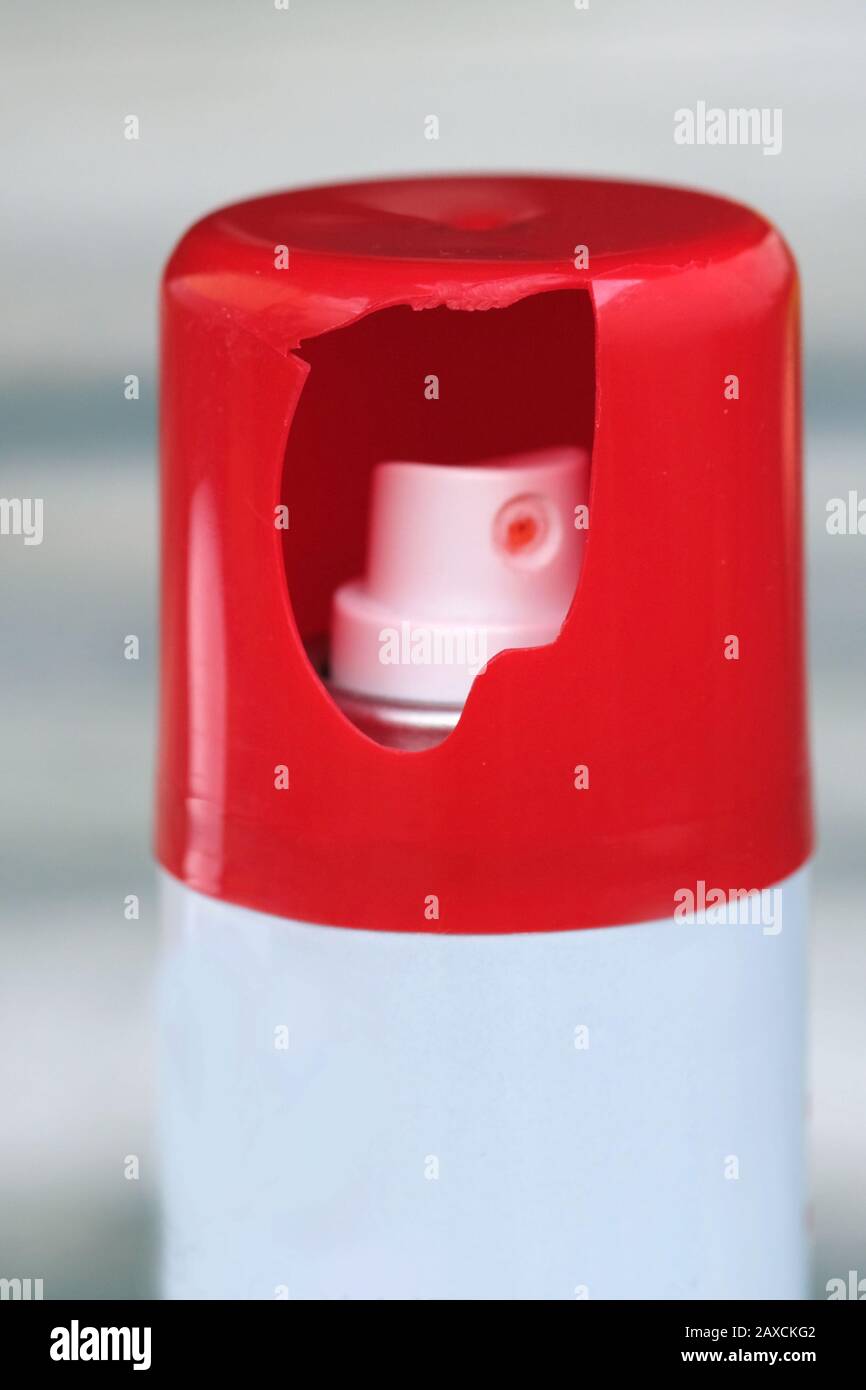 Red plastic cap with a hole. The lid on the spray can with a deodorant ...