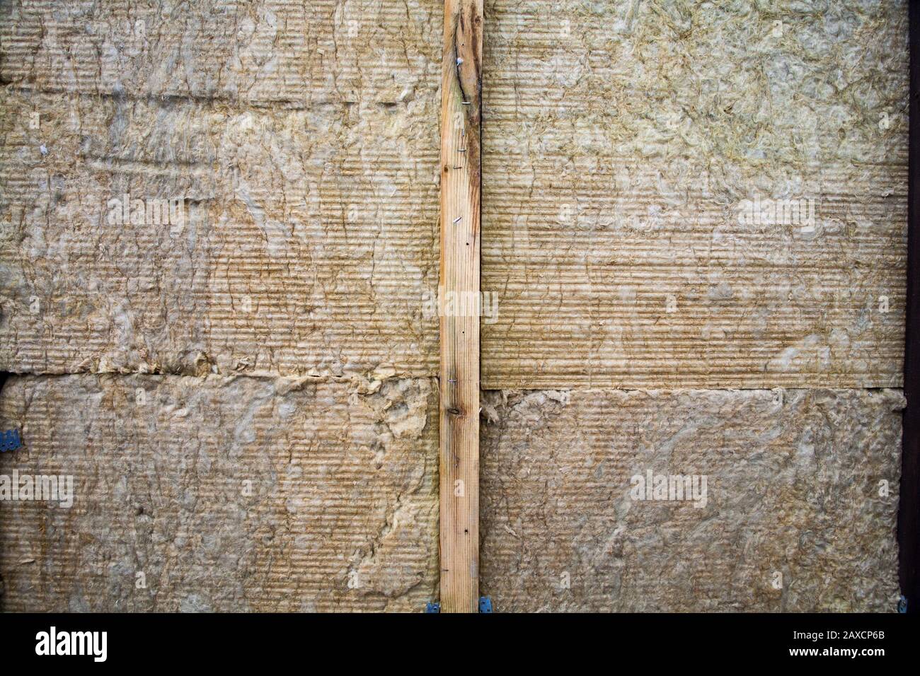 warming the walls of a stone house with a stone wool heater. Ecological ...