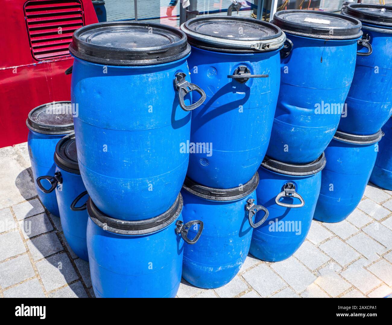 blue plastic barrels Stock Photo - Alamy