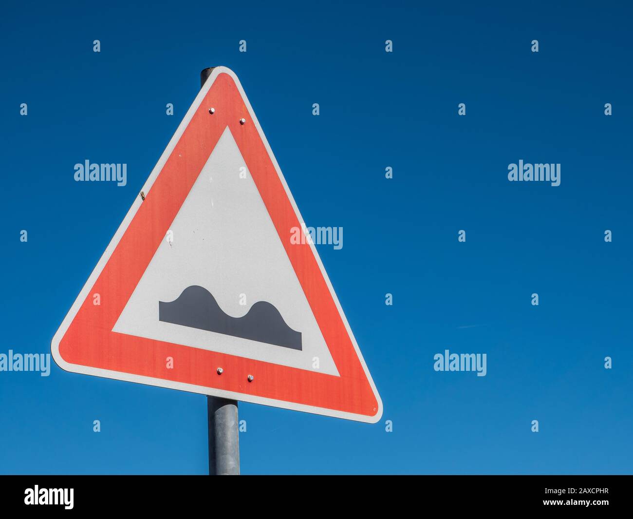Attention road damage sign in Germany Stock Photo - Alamy