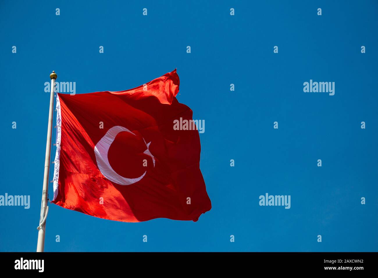 Turkish national flag with white star and moon in sky Stock Photo - Alamy
