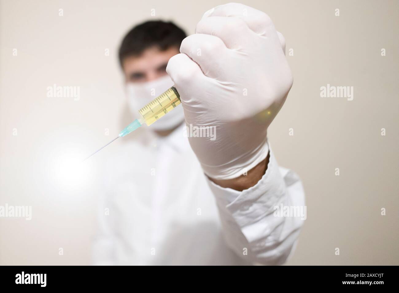 Vaccine in syringe held hi-res stock photography and images - Alamy