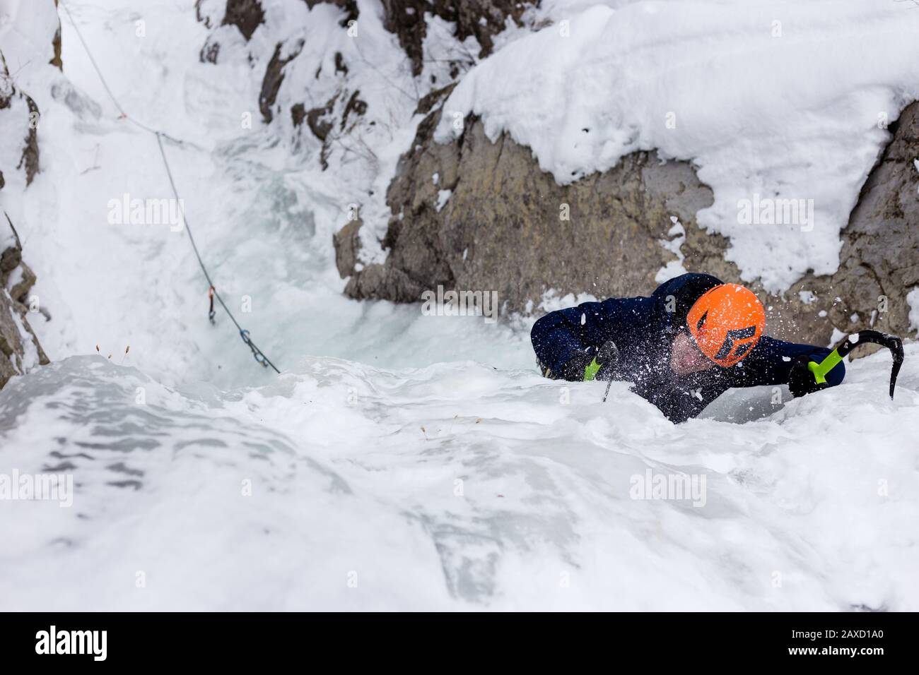Male ice climber on dangerous route action shot Stock Photo - Alamy
