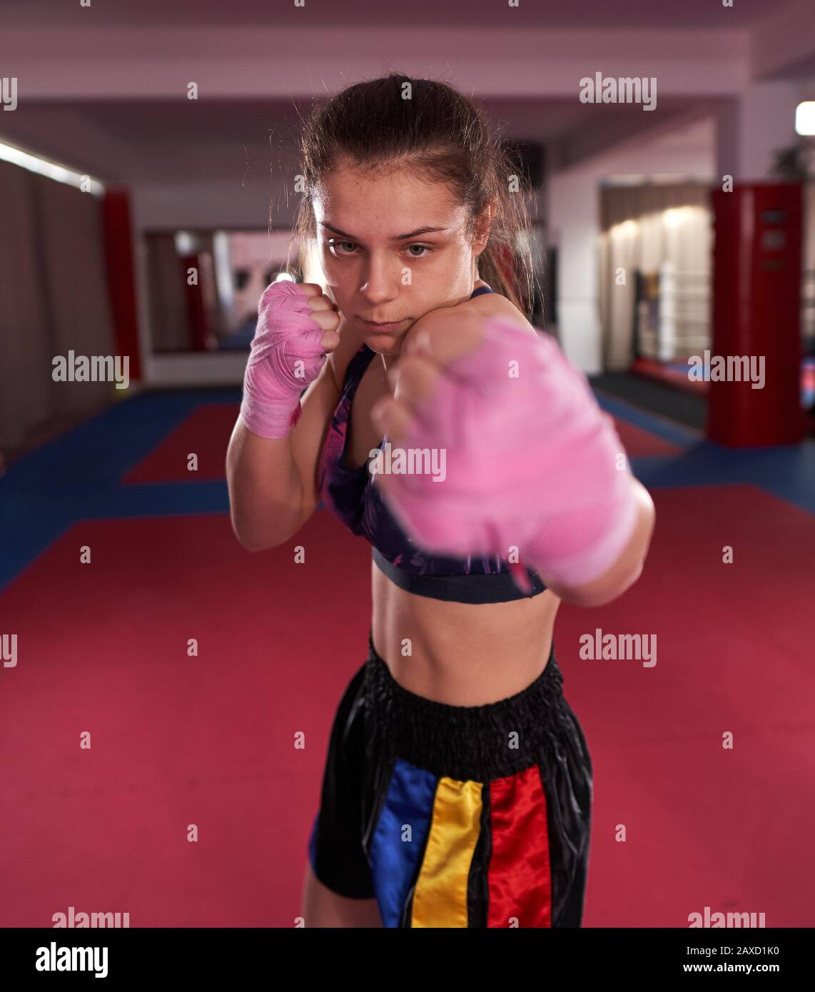 Kickboxer girl shadow boxing and kicking Stock Photo - Alamy