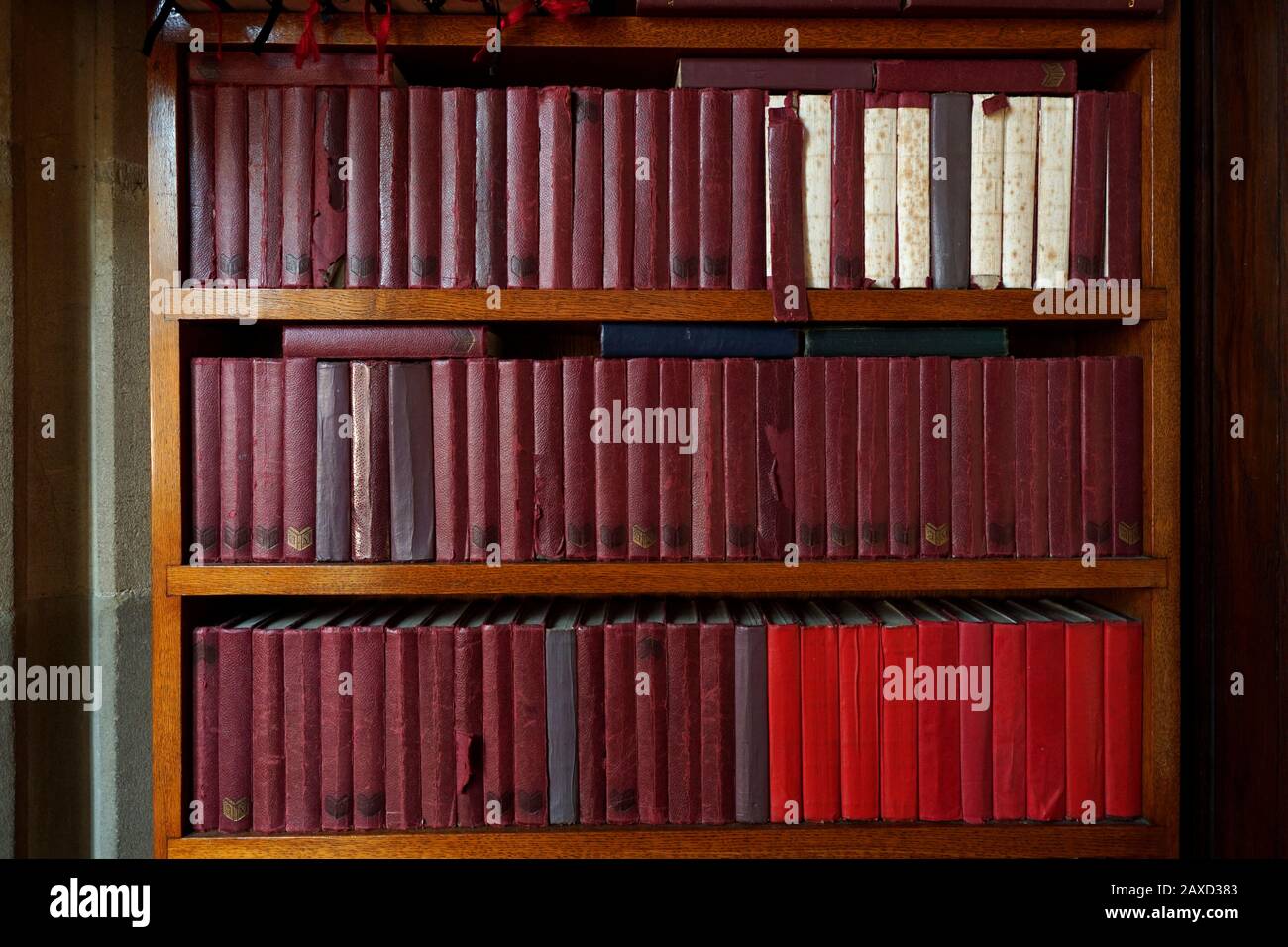 Old and worn hymn books on a bookcase in a church Stock Photo - Alamy