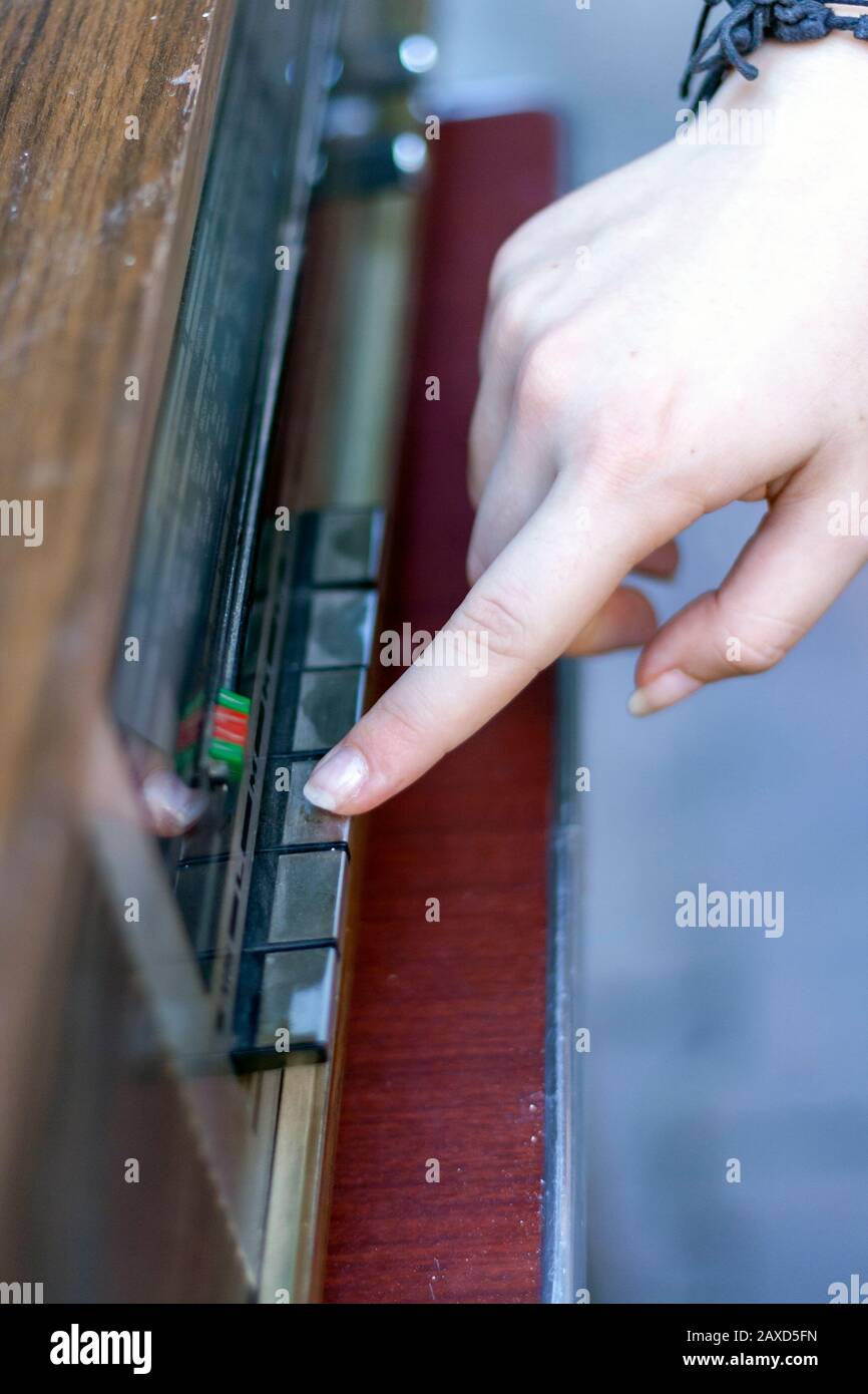 woman tuning knob and push button on retro style radio player Stock ...