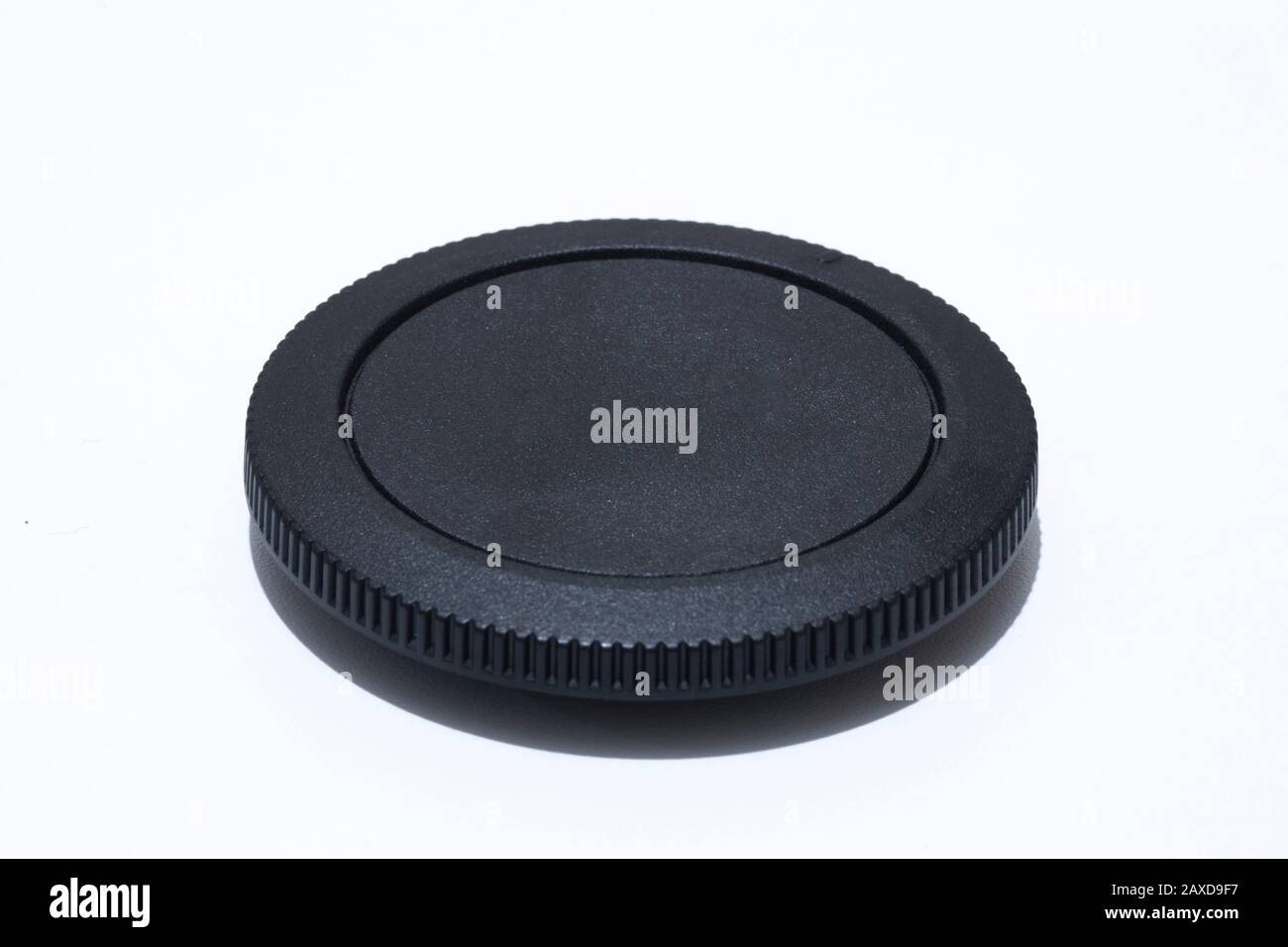 Camera body cap close-up. In white background Stock Photo - Alamy