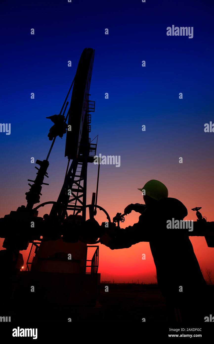 oil field, the oil workers are working Stock Photo - Alamy