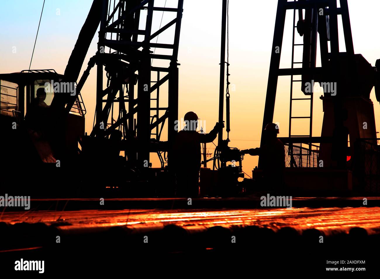 oil field, the oil workers are working Stock Photo - Alamy