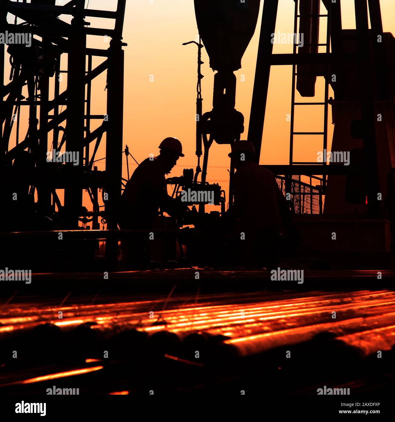 oil field, the oil workers are working Stock Photo - Alamy