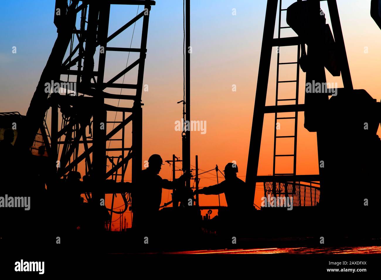 oil field, the oil workers are working Stock Photo - Alamy