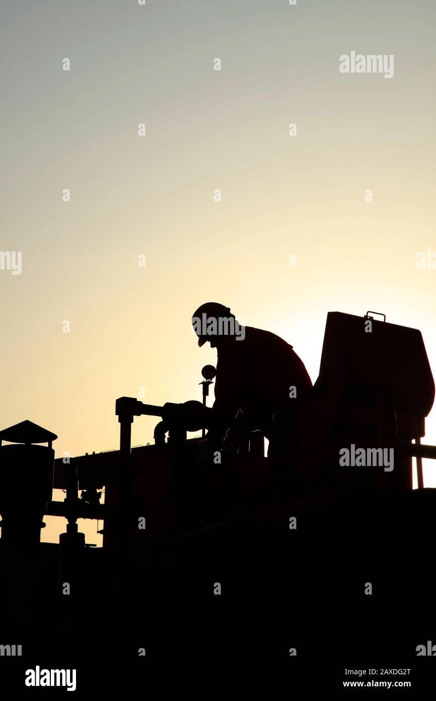 oil field, the oil workers are working Stock Photo - Alamy