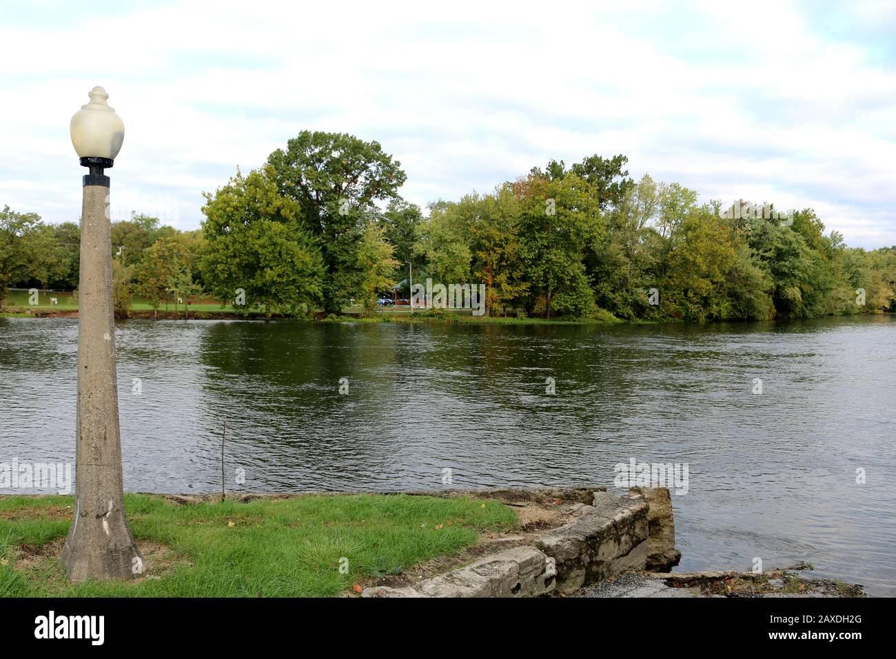 a river dock park with lamp post Stock Photo - Alamy