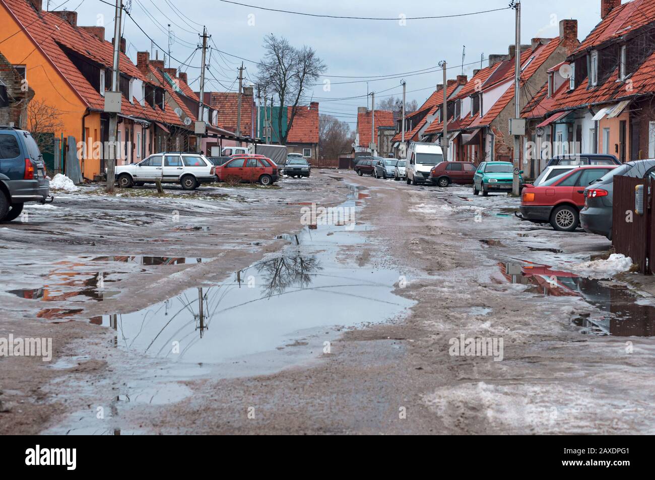 old single-storey houses, dirty street without a road, Baltiysk ...