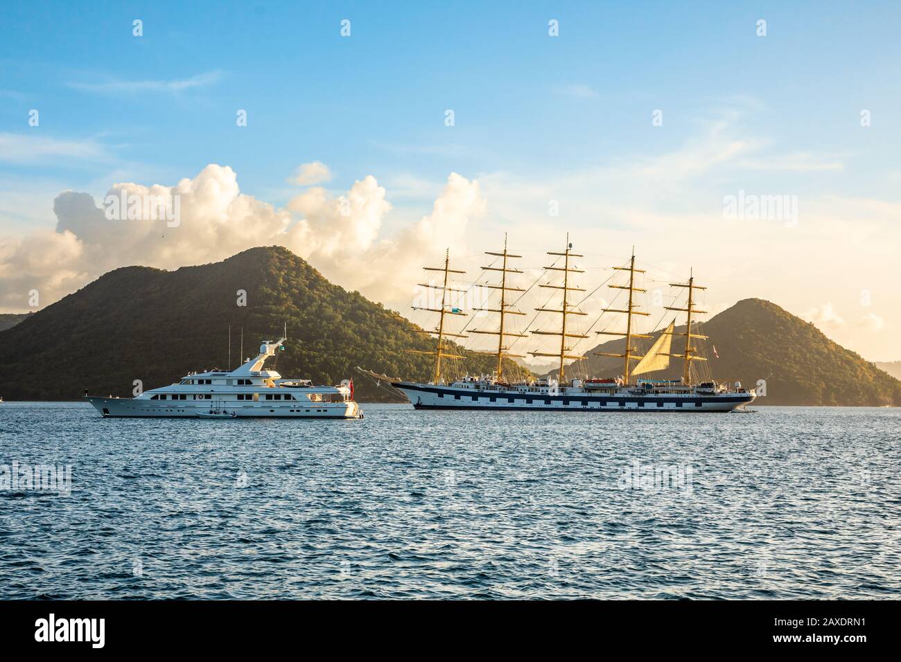 Motor yacht and big naval clipper anchored at the Rodney bay with ...